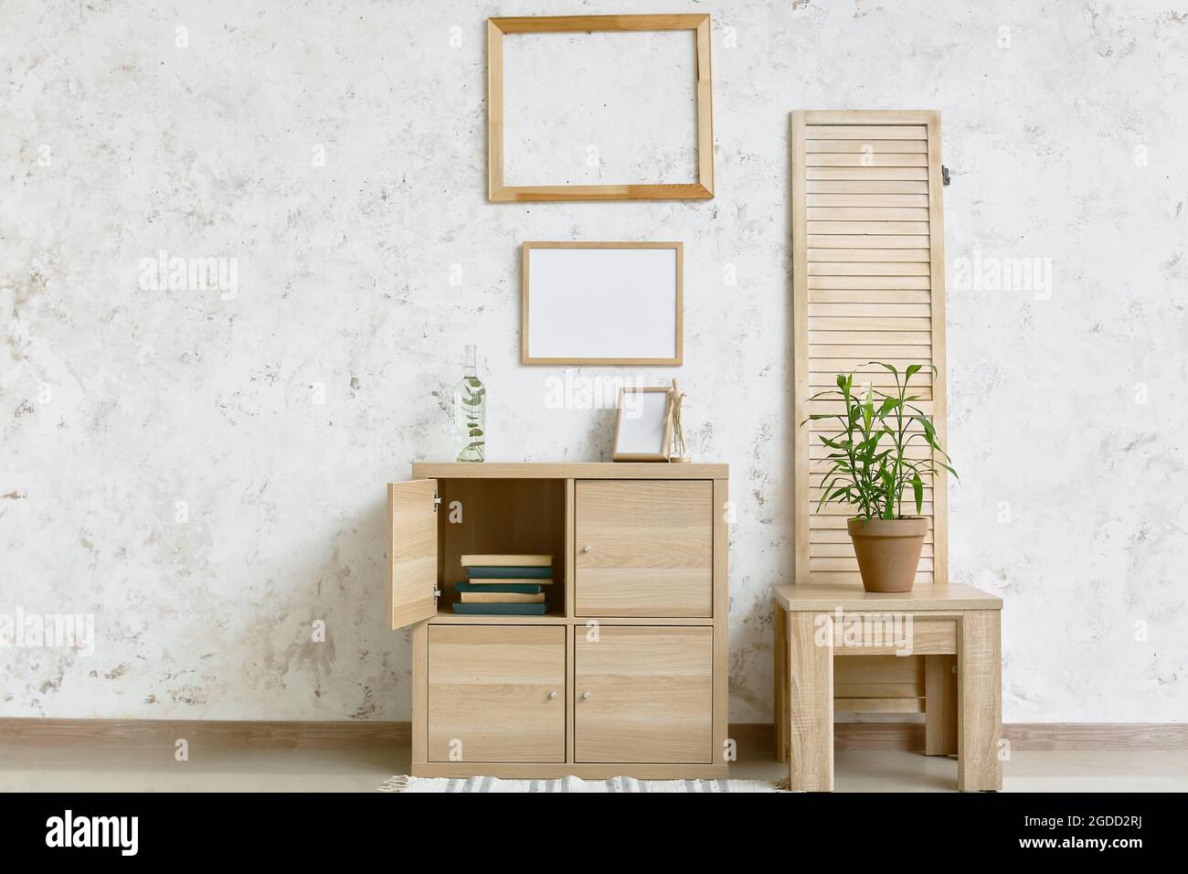 Interior of stylish living room with modern chest of drawers Stock ...