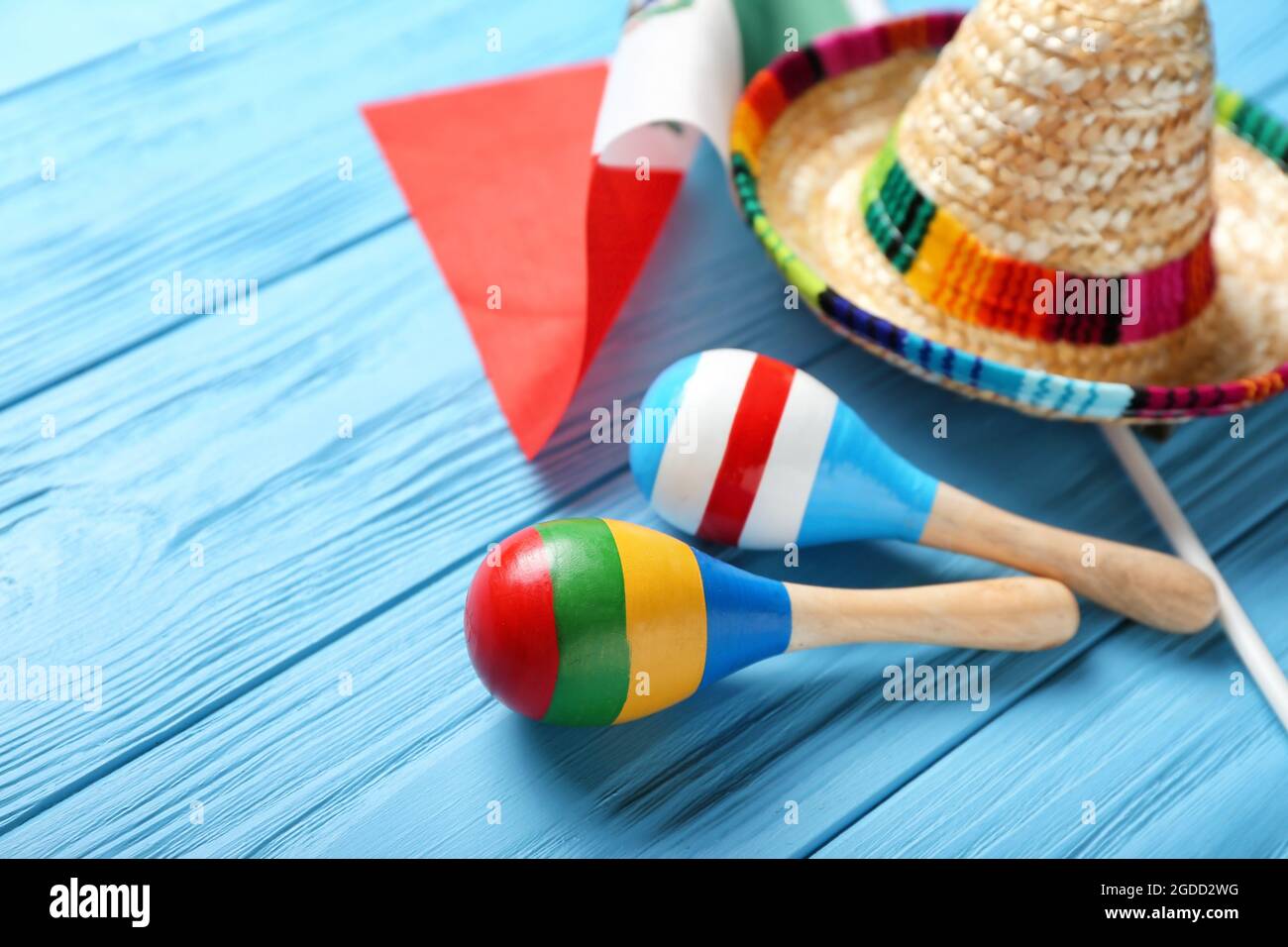 Mexican flag, maracas and sombrero on color wooden background Stock ...