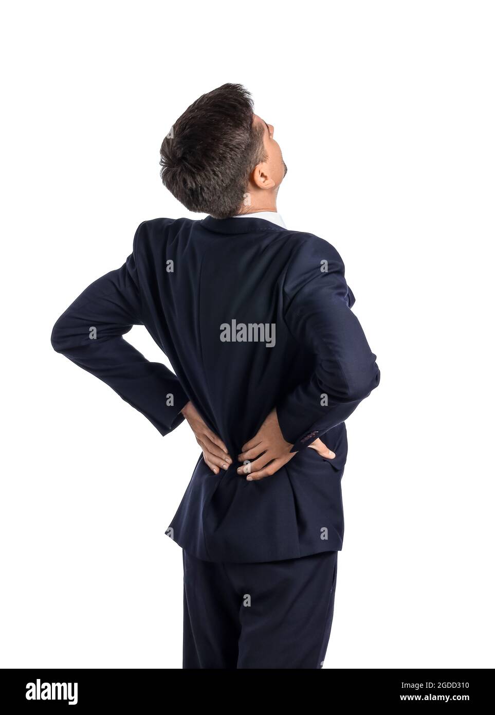Young businessman suffering from back pain on white background Stock ...