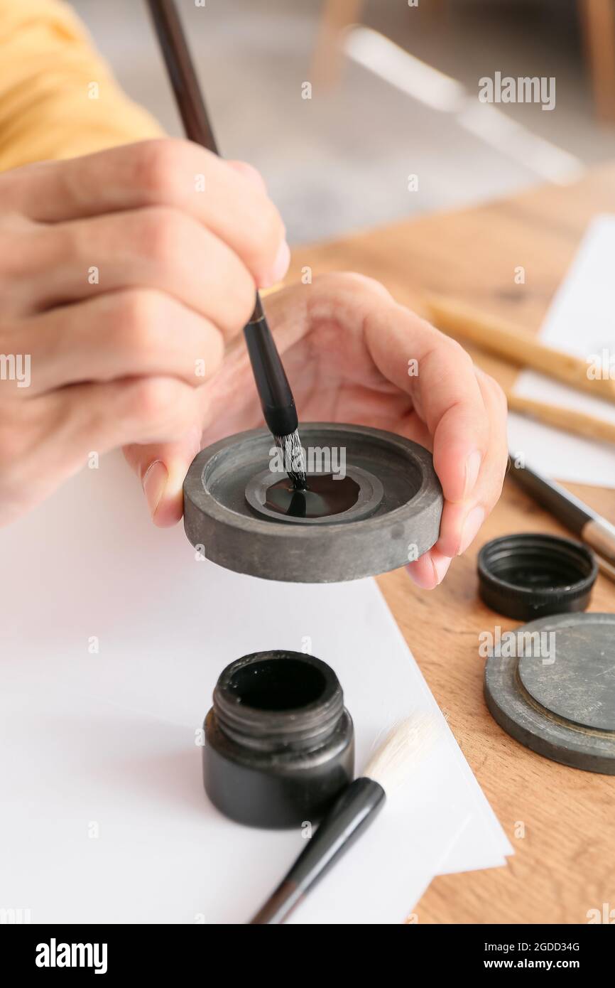Calligrapher paints hi-res stock photography and images - Alamy