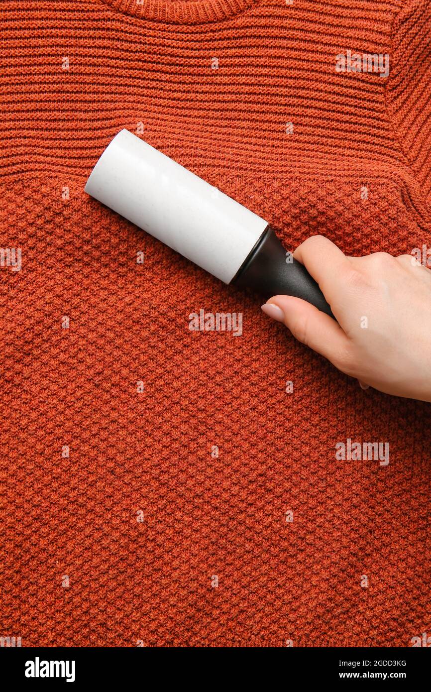 Woman removing her sweater hi-res stock photography and images - Alamy