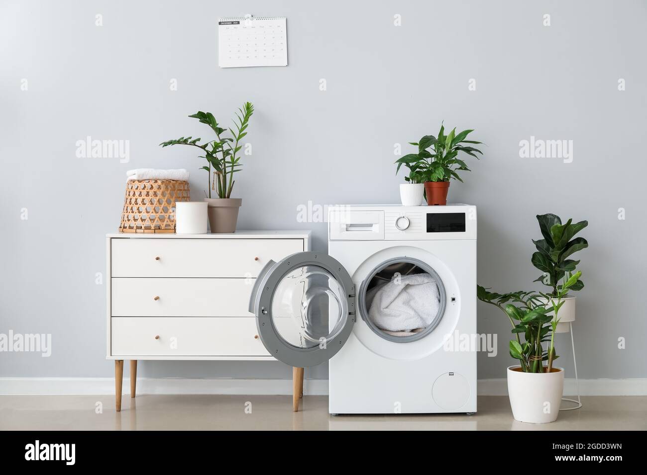Interior of bathroom with modern washing machine Stock Photo - Alamy