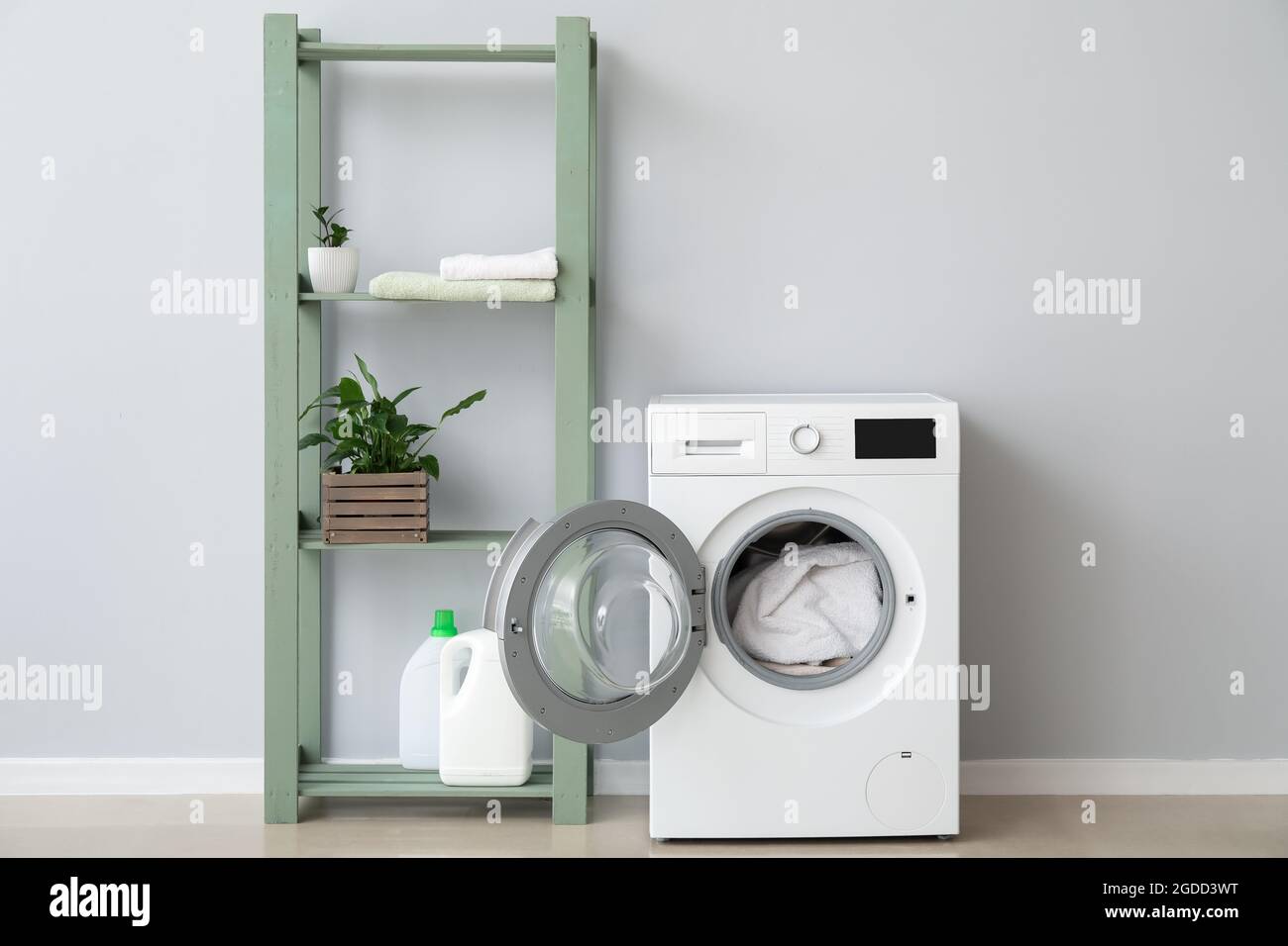 Interior of bathroom with modern washing machine Stock Photo - Alamy
