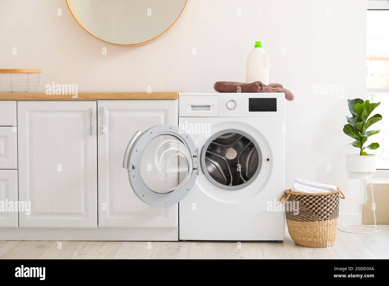 Interior of kitchen with modern washing machine Stock Photo - Alamy