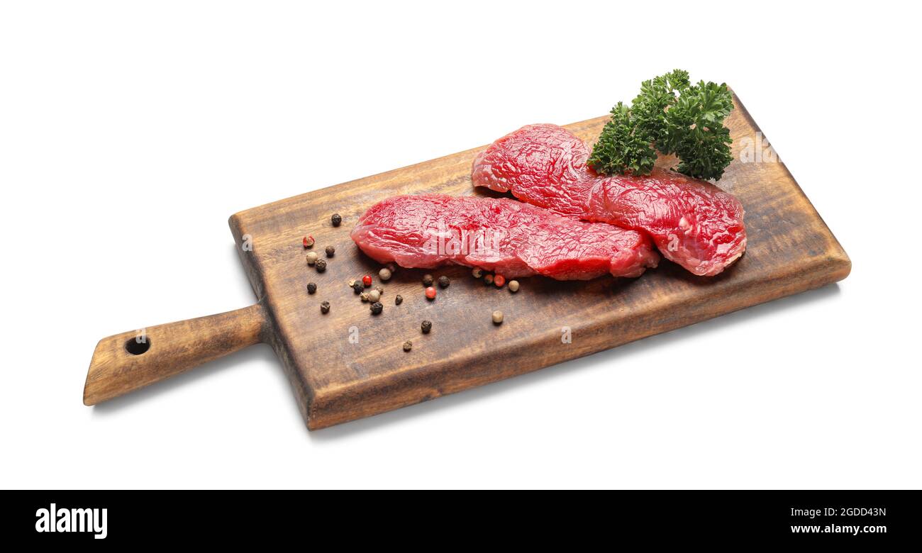 Wooden board with raw beef meat on white background Stock Photo - Alamy