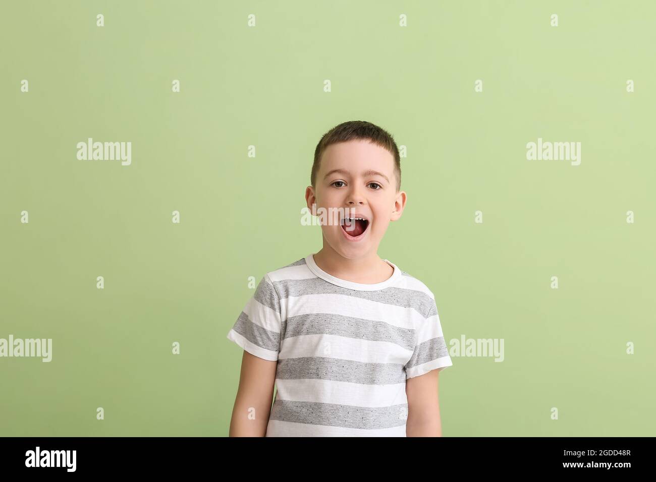 Little boy training pronounce letters on color background Stock Photo ...