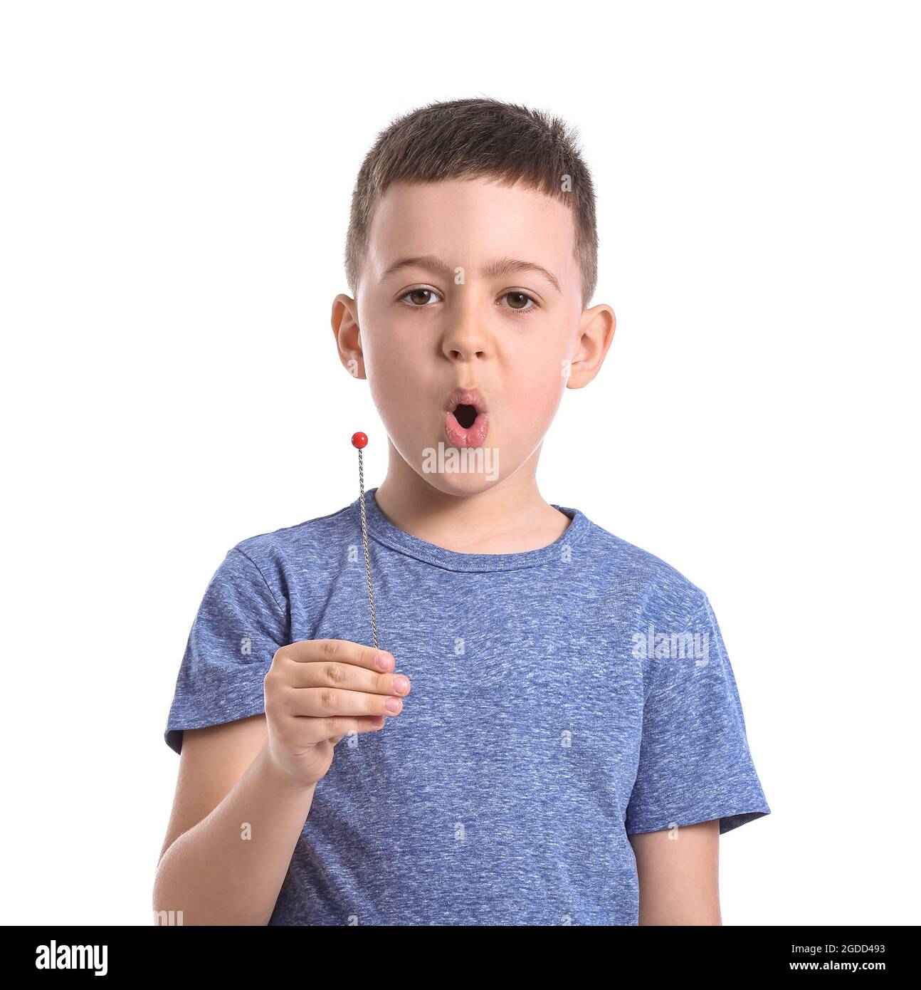Little boy with logopedic tool for speech correction on white ...