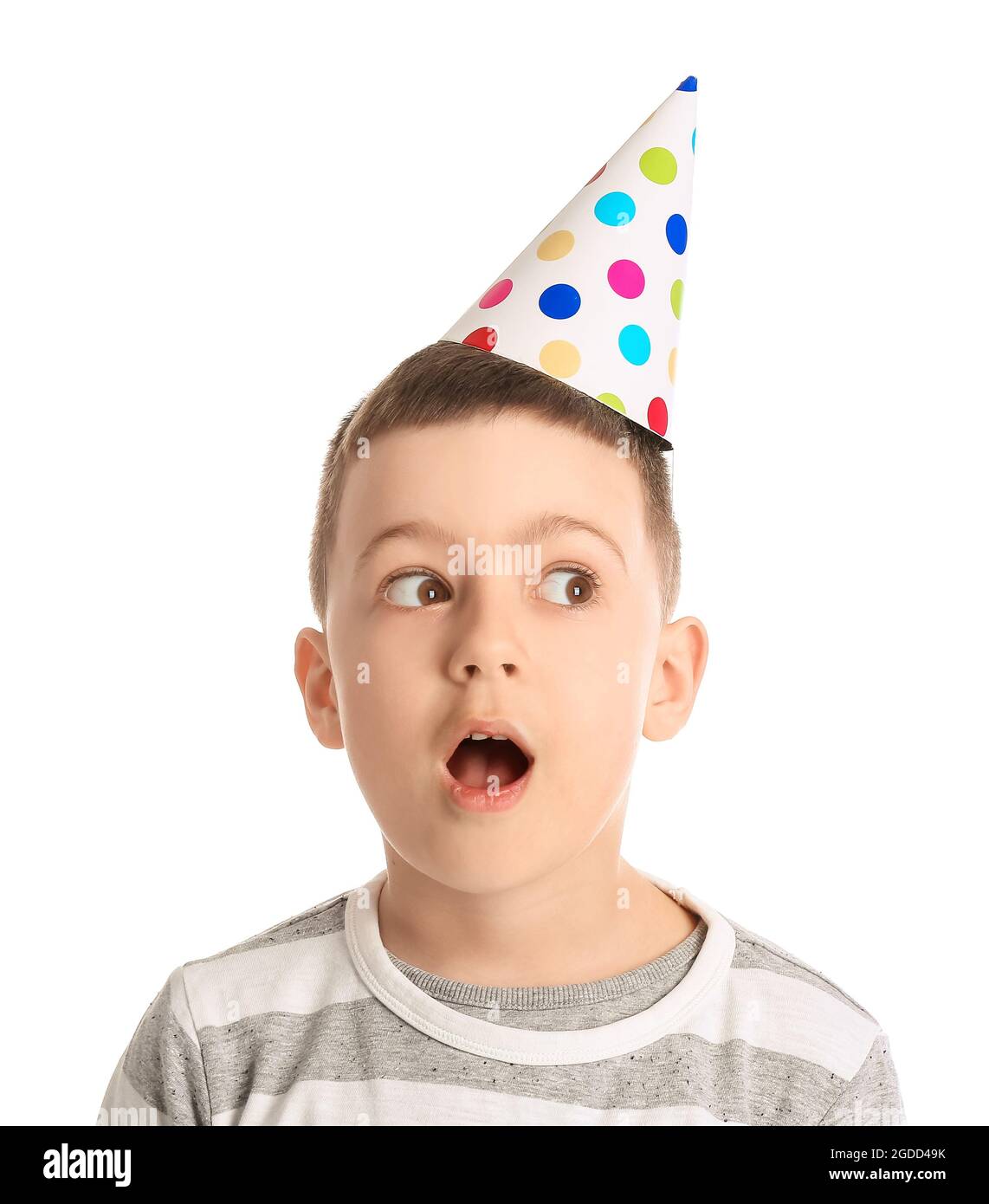 Shocked little boy in party hat on white background Stock Photo - Alamy