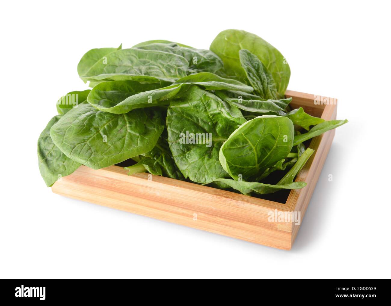 Wooden box with fresh spinach leaves on white background Stock Photo ...