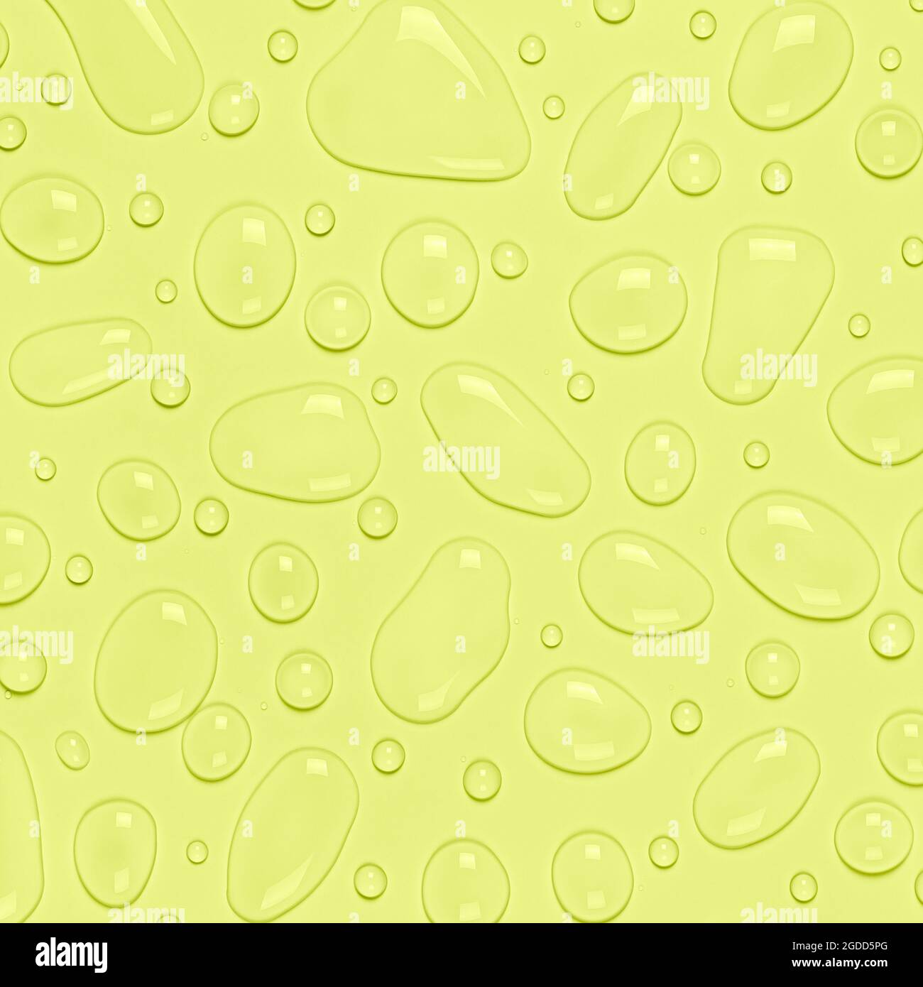 Water drops on a pastel yellow background. Water texture close up ...