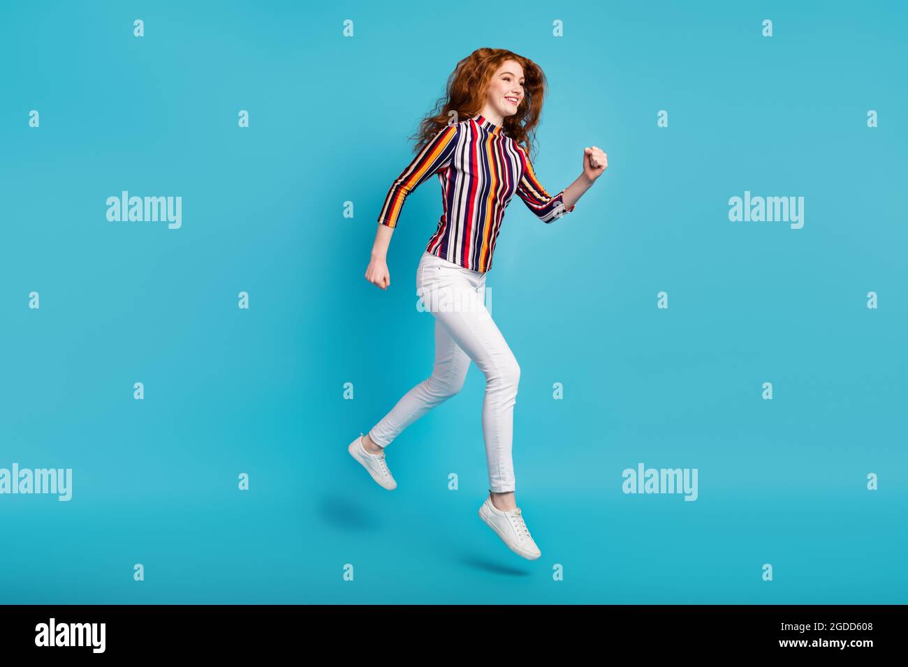 Full length body size view of attractive cheerful girl jumping running ...