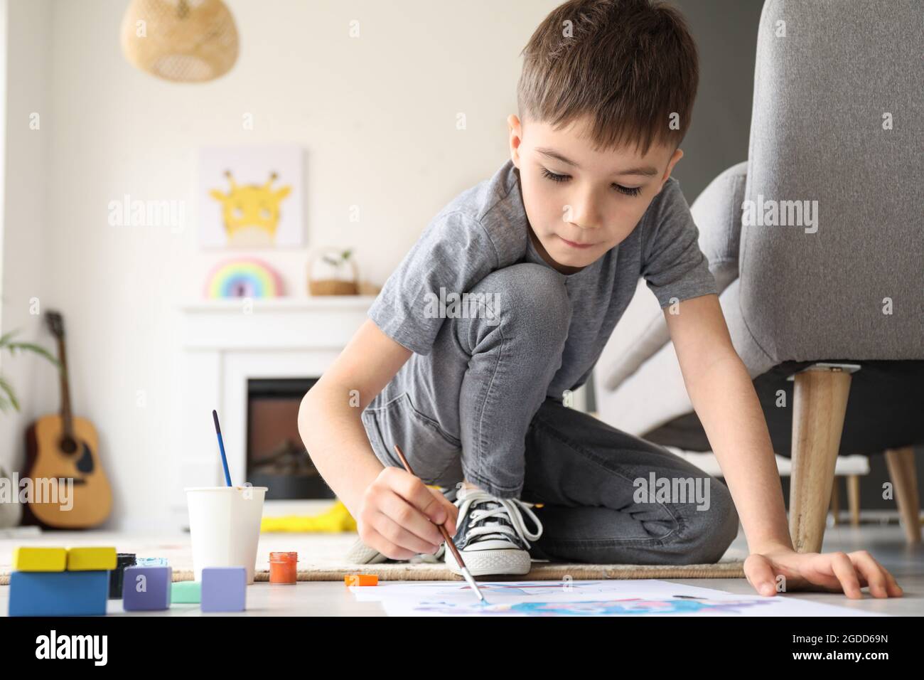 Little boy painting at home Stock Photo - Alamy