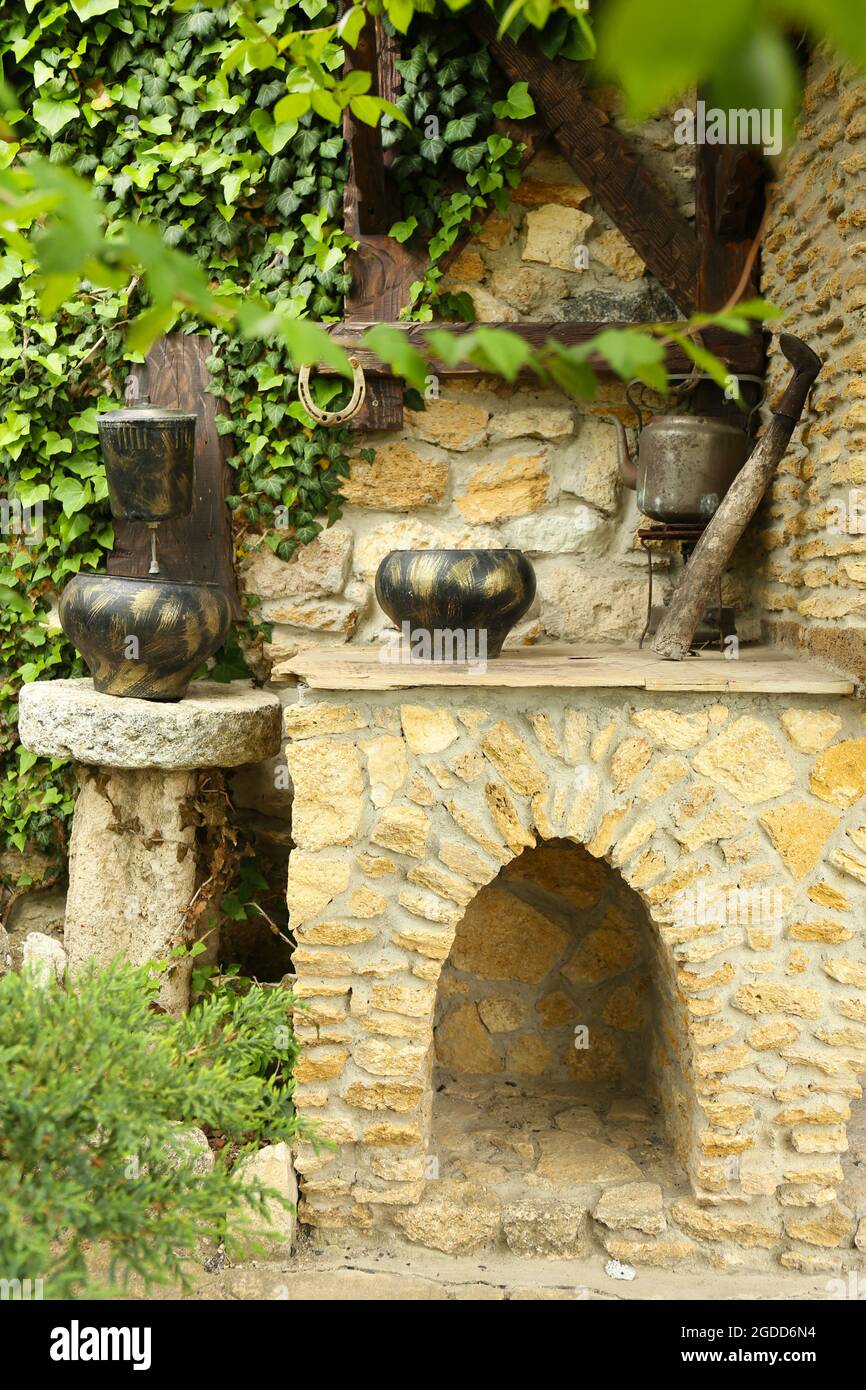 Old retro cauldrons in garden Stock Photo - Alamy