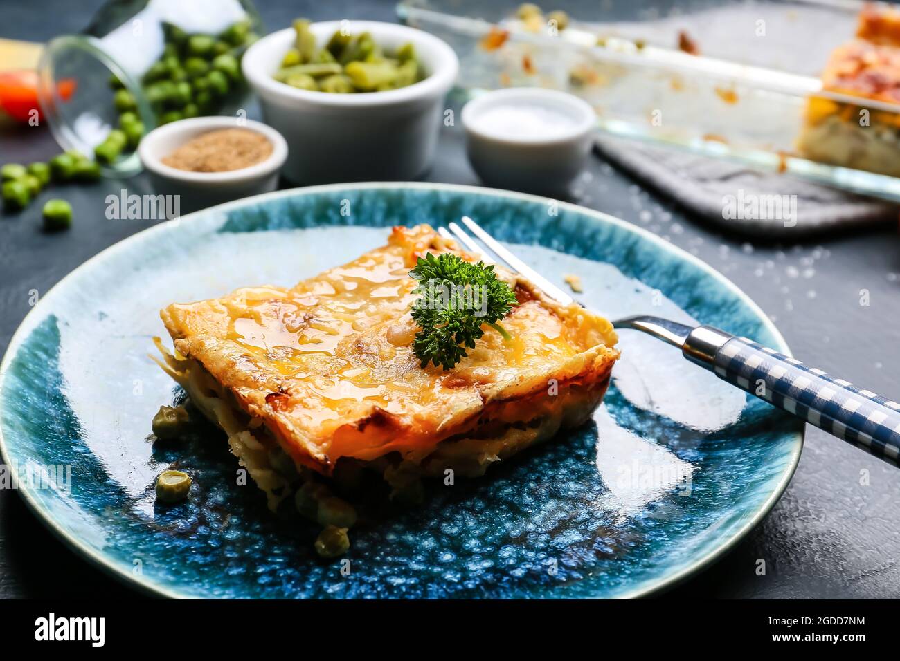 Plate with tasty vegetable lasagna on dark background, closeup Stock ...
