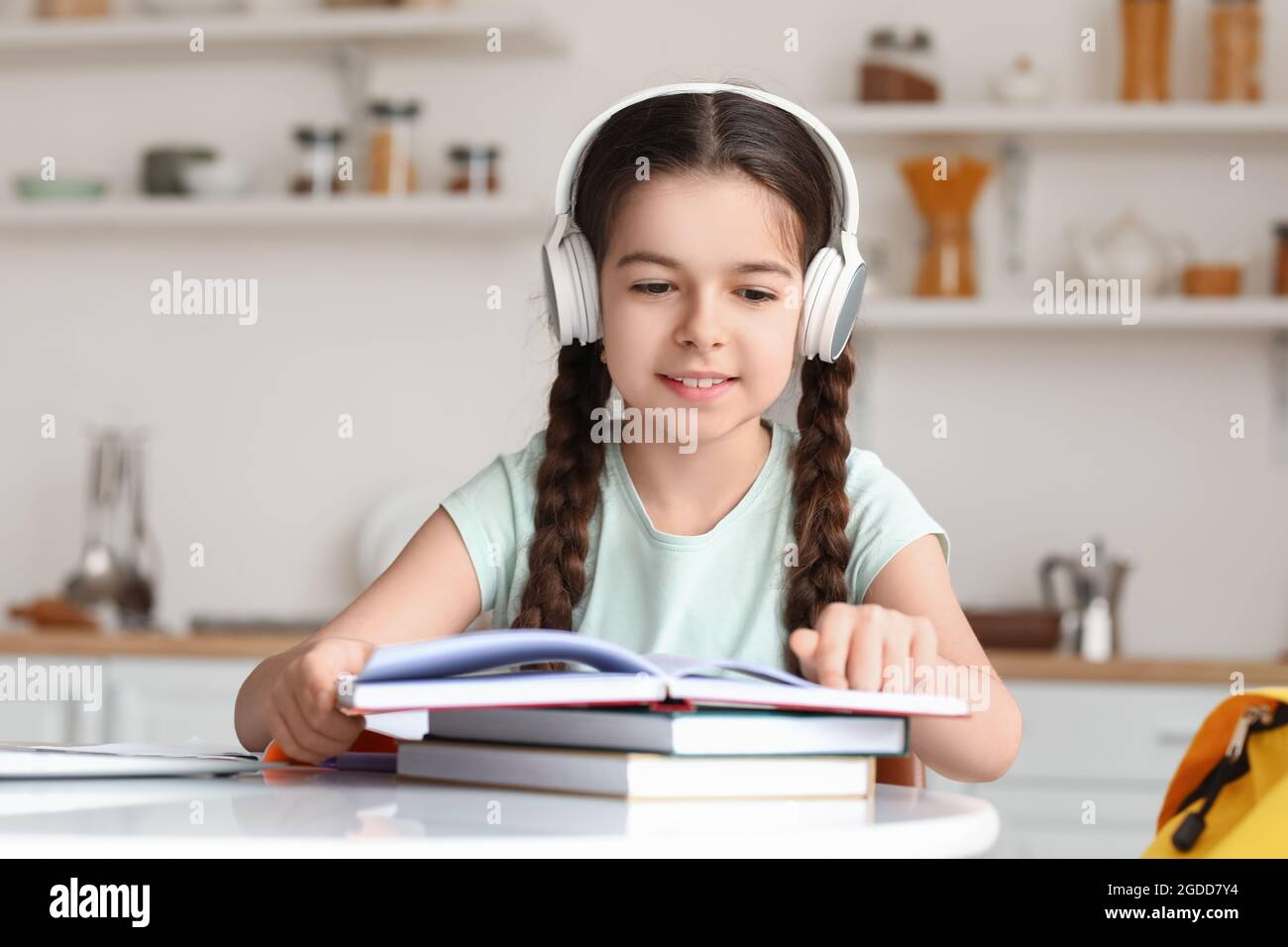 Little girl studying online at home Stock Photo - Alamy