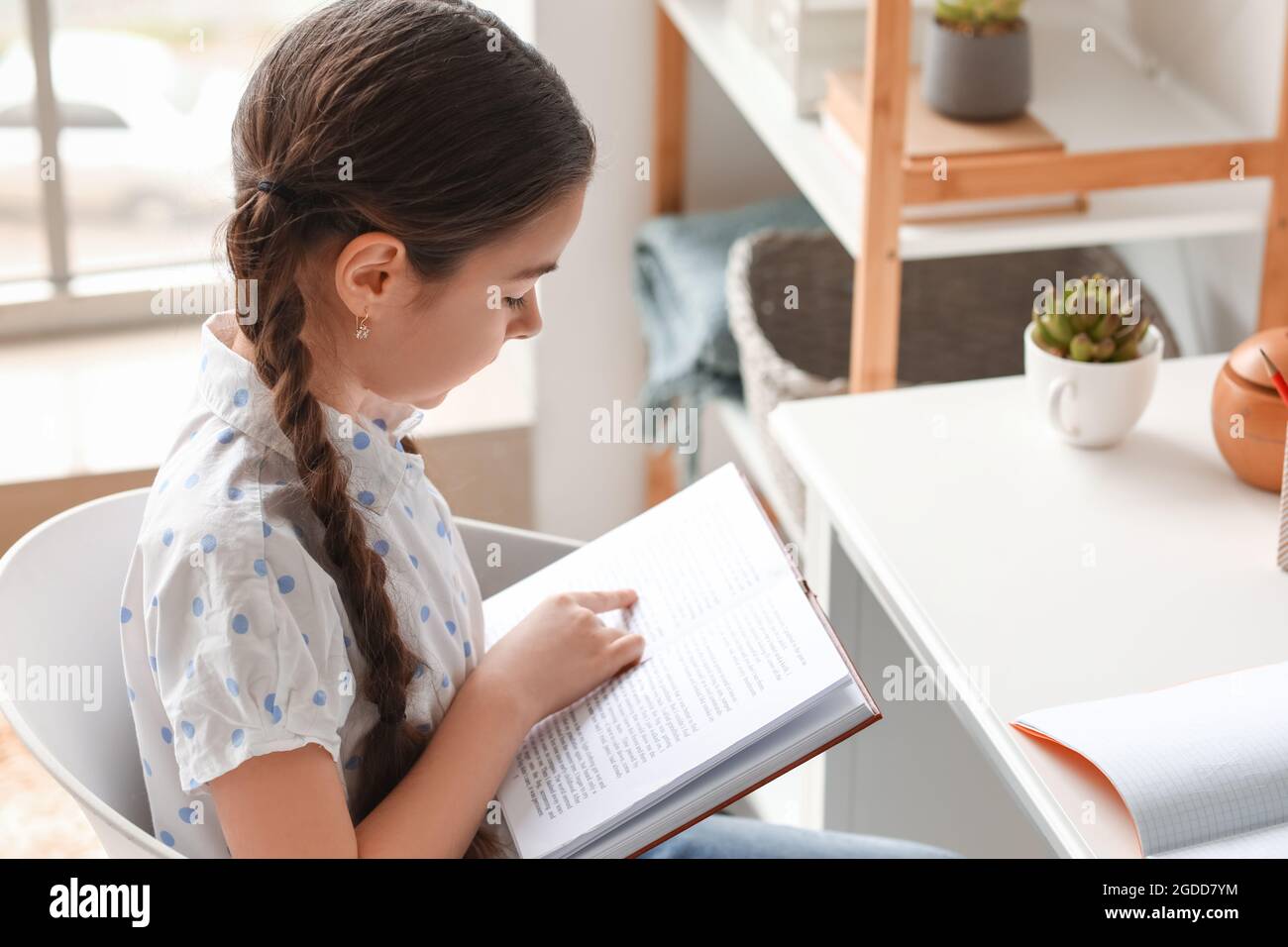 Little girl studying at home Stock Photo - Alamy