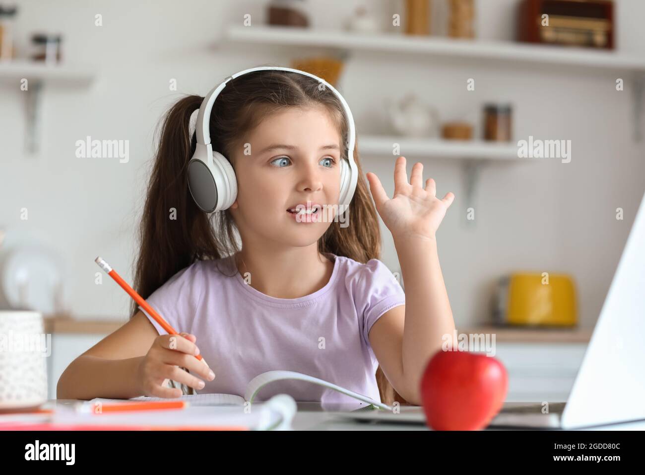 Little girl studying online at home Stock Photo - Alamy