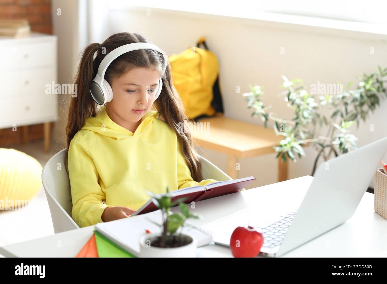Little girl studying online at home Stock Photo - Alamy