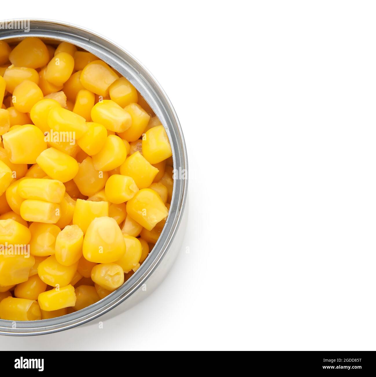 Opened tin can of corn kernels on white background Stock Photo - Alamy