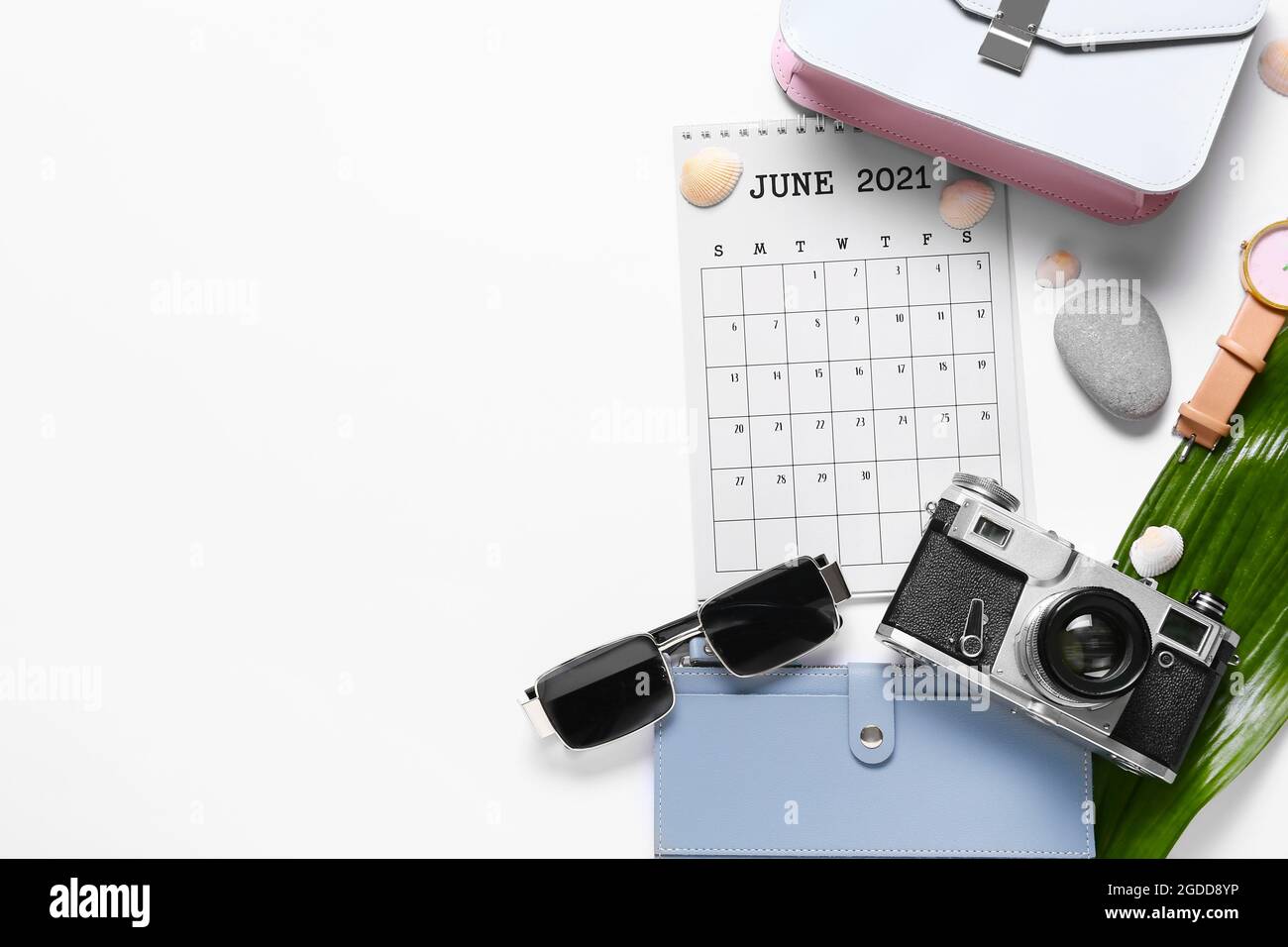 Calendar, photo camera and female accessories on white background Stock ...