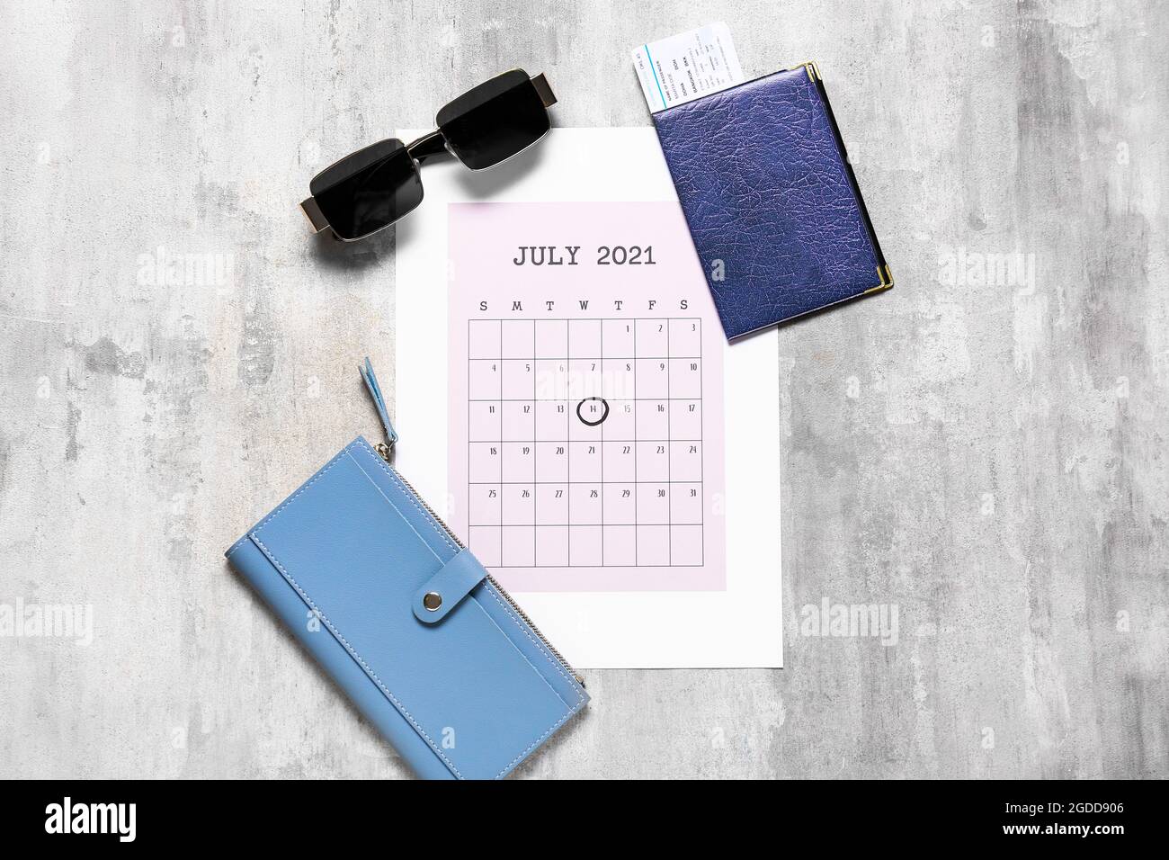 Calendar with marked date, passport, ticket and female accessories on ...