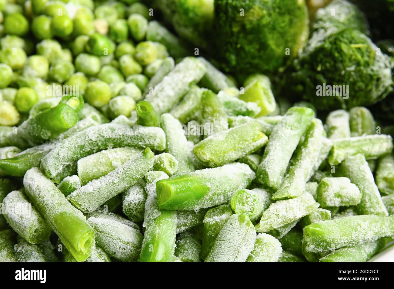 Frozen green vegetables as background, closeup Stock Photo - Alamy