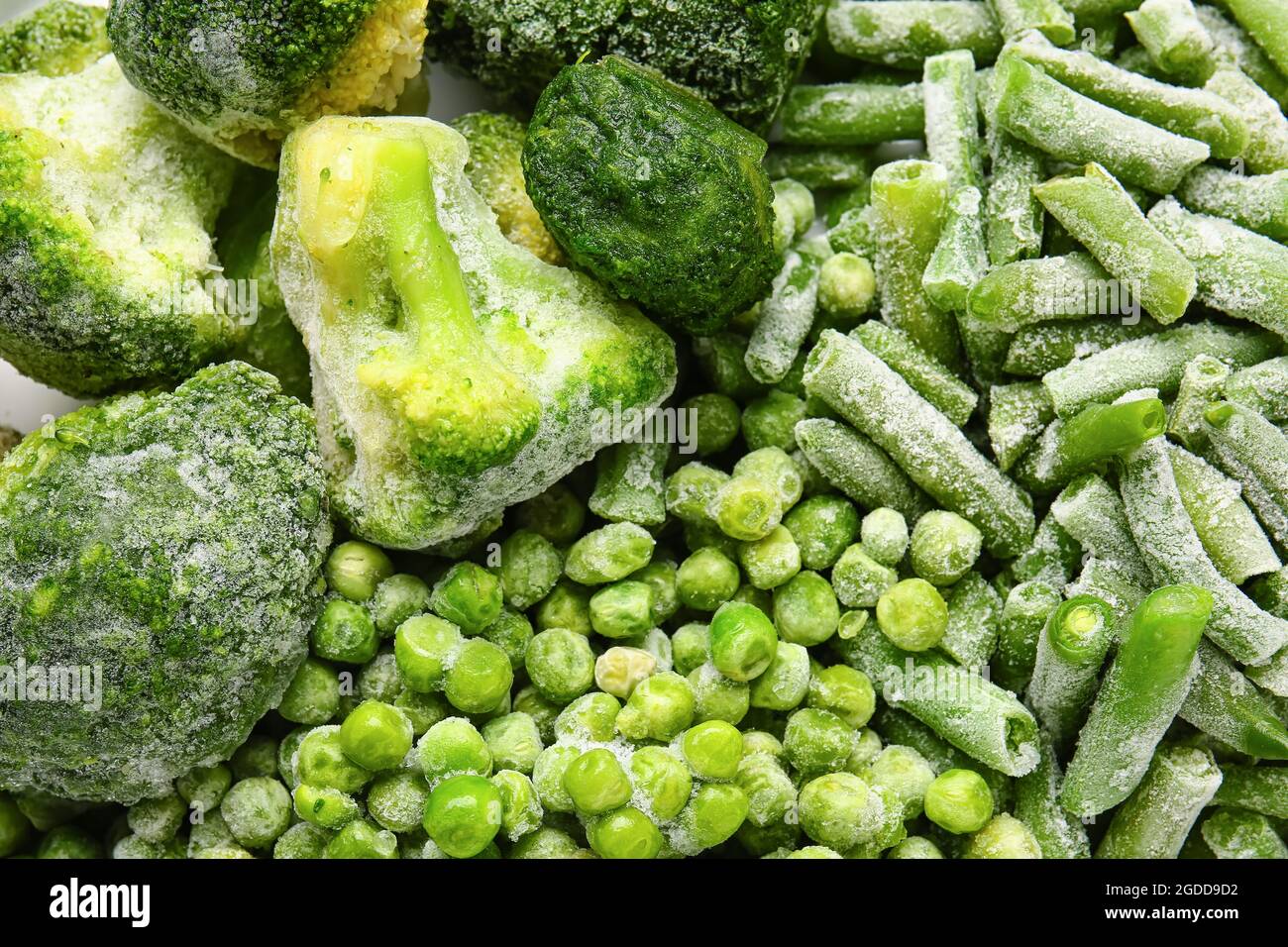 Frozen green vegetables as background, closeup Stock Photo - Alamy