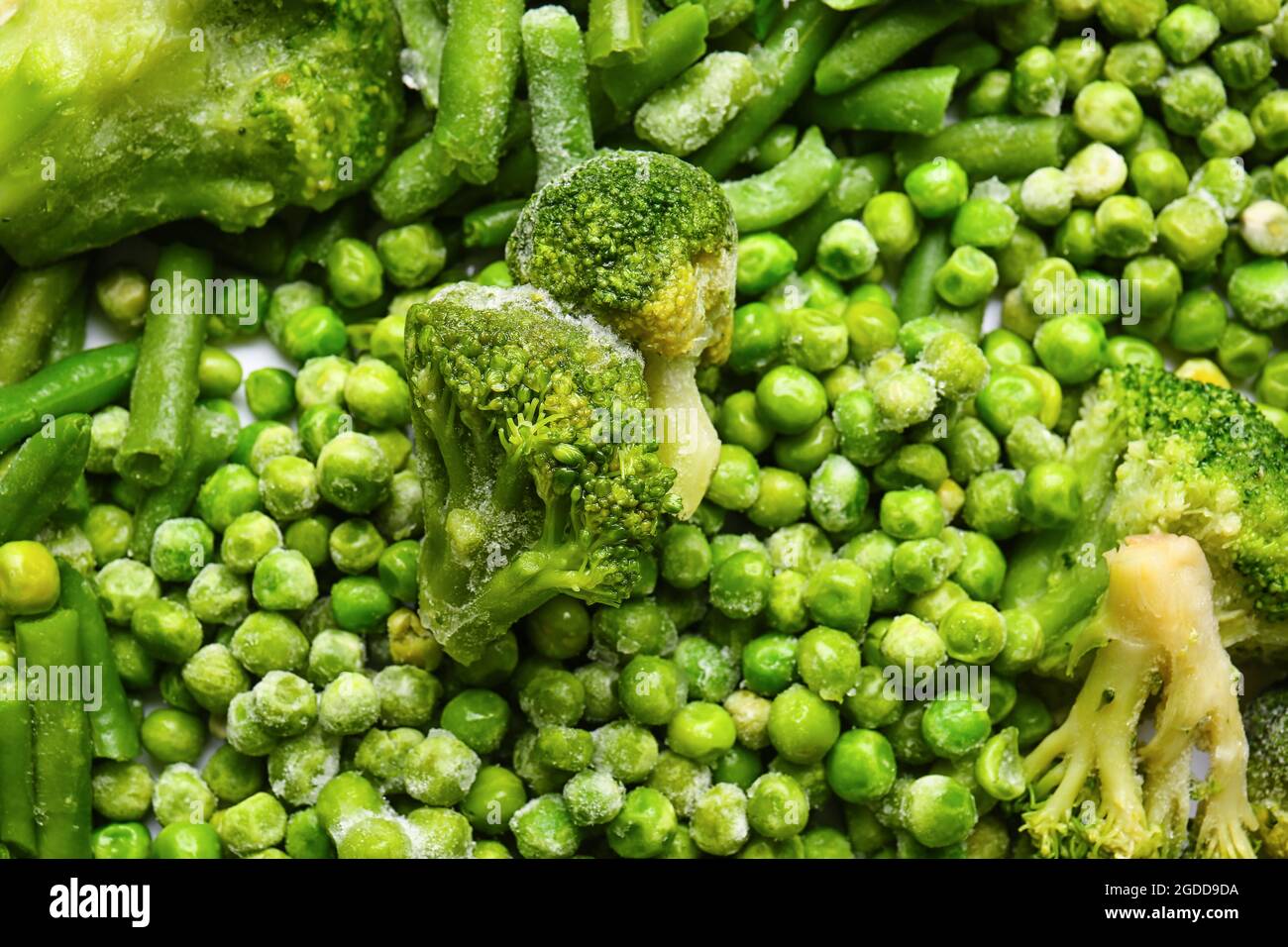 Frozen green vegetables as background, closeup Stock Photo - Alamy