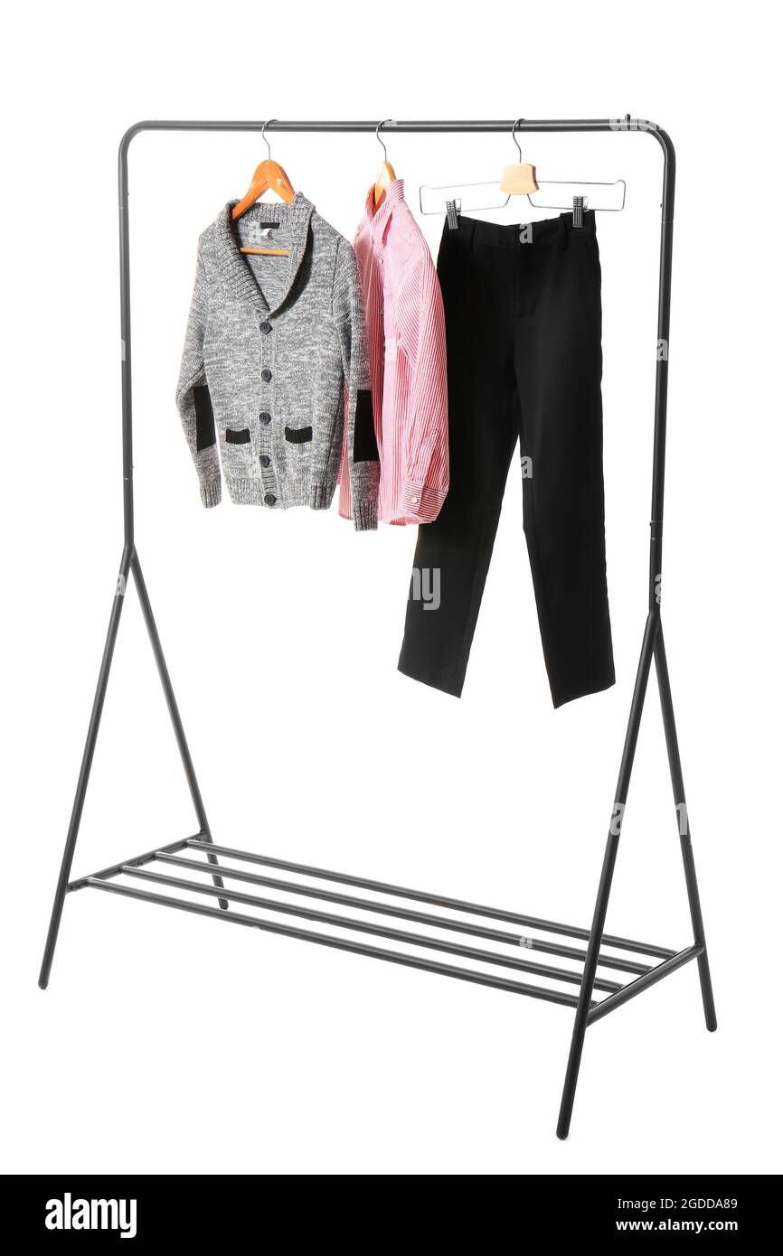 Rack with stylish school uniform on white background Stock Photo - Alamy