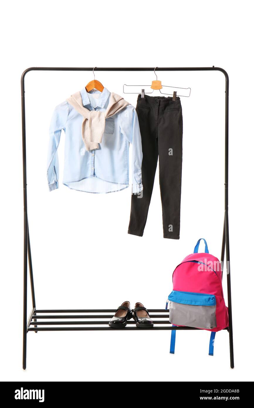 Rack with stylish school uniform on white background Stock Photo - Alamy