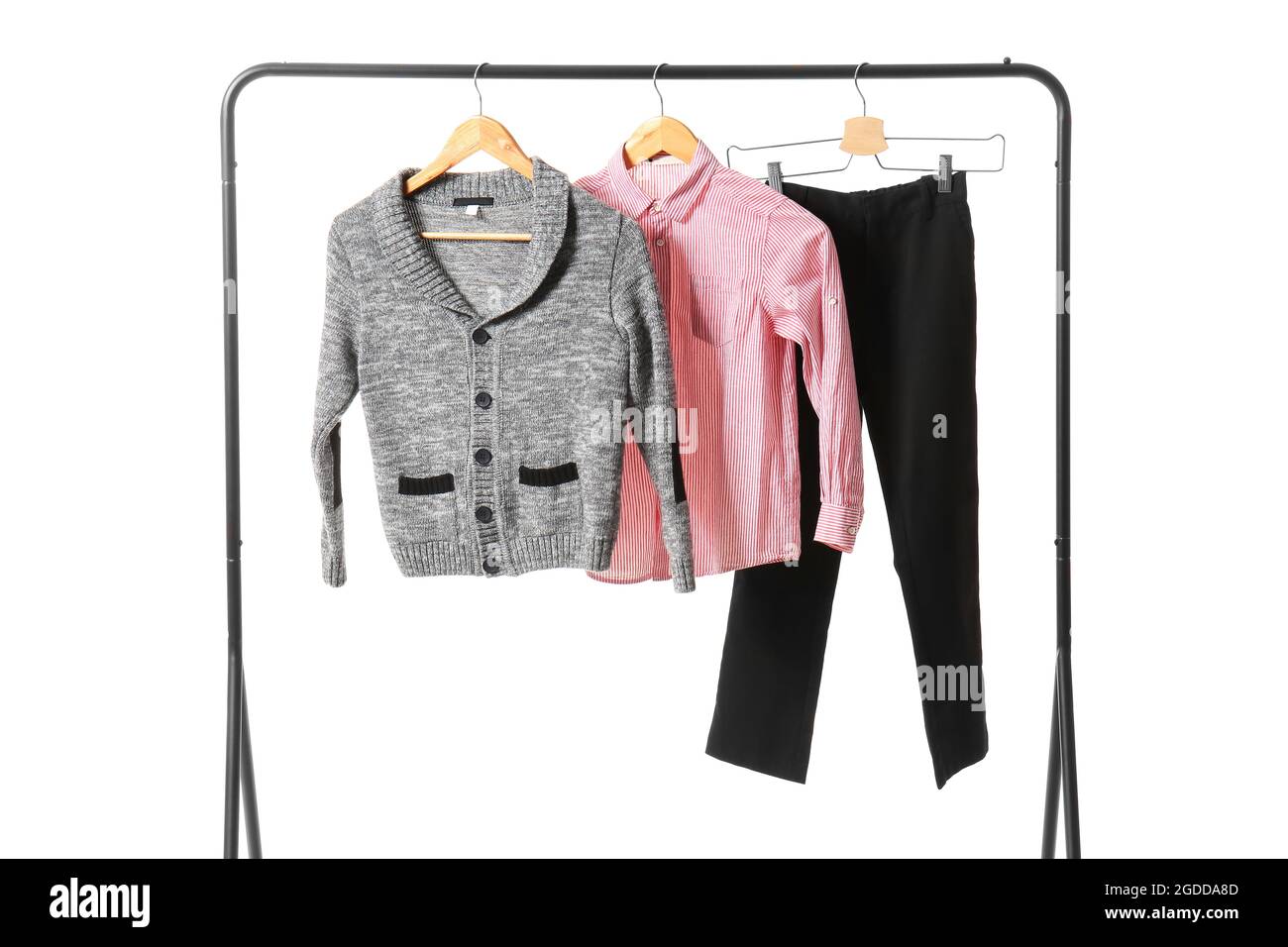 Rack with stylish school uniform on white background Stock Photo - Alamy