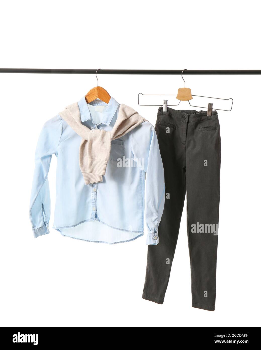 Rack with stylish school uniform on white background Stock Photo - Alamy