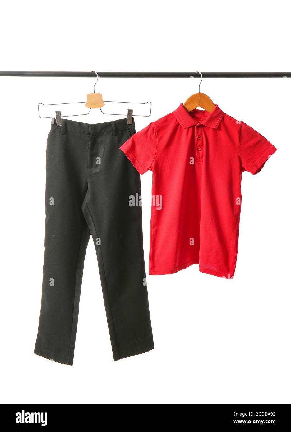 Rack with stylish school uniform on white background Stock Photo - Alamy