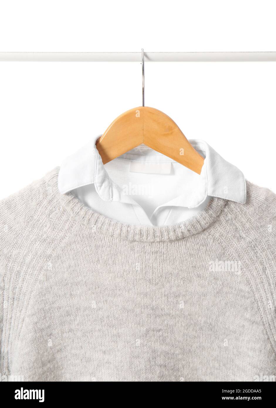 Rack with stylish school uniform on white background Stock Photo - Alamy