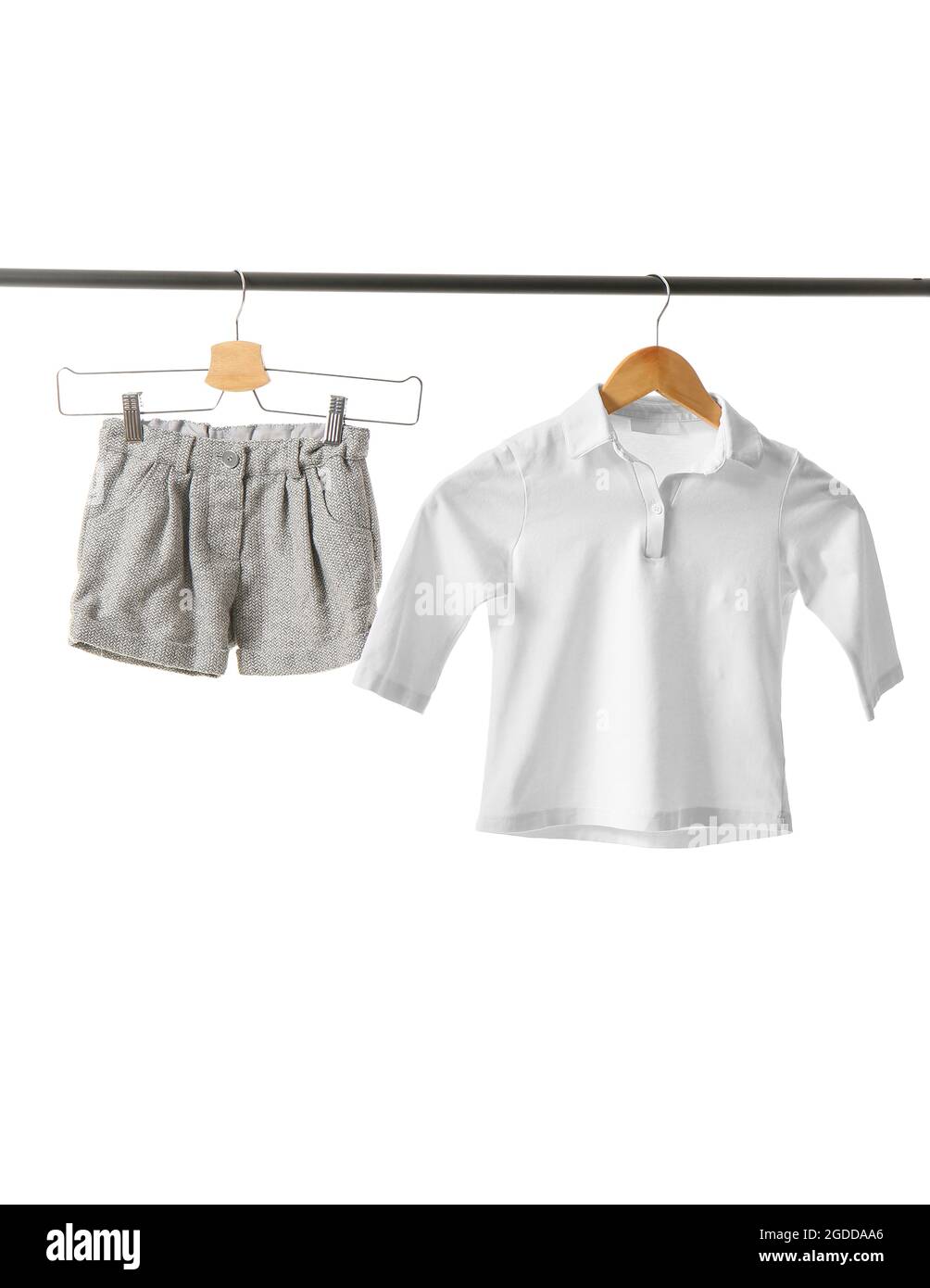 Rack with stylish school uniform on white background Stock Photo - Alamy