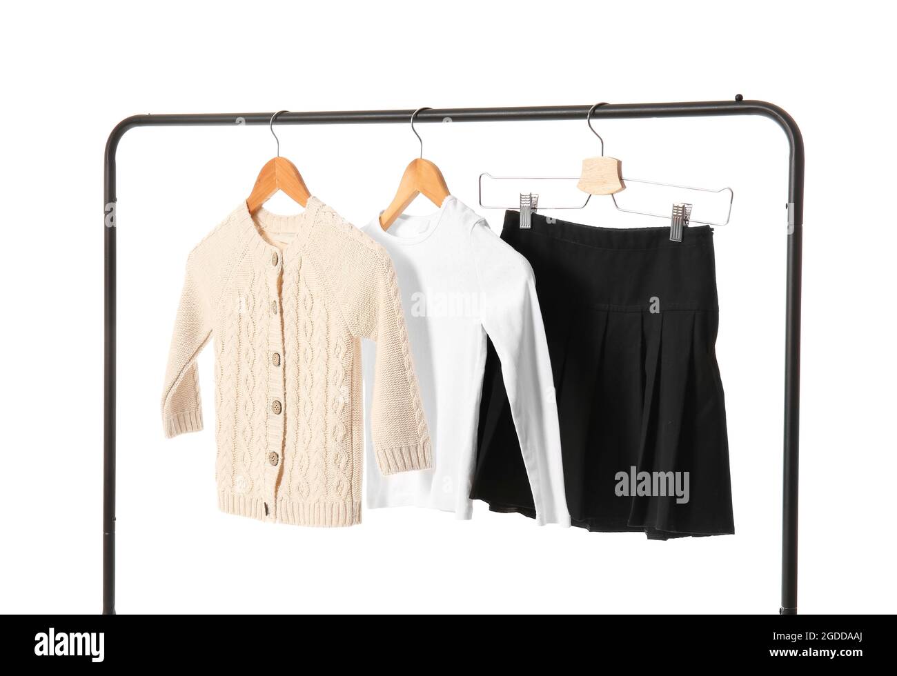 Rack with stylish school uniform on white background Stock Photo - Alamy