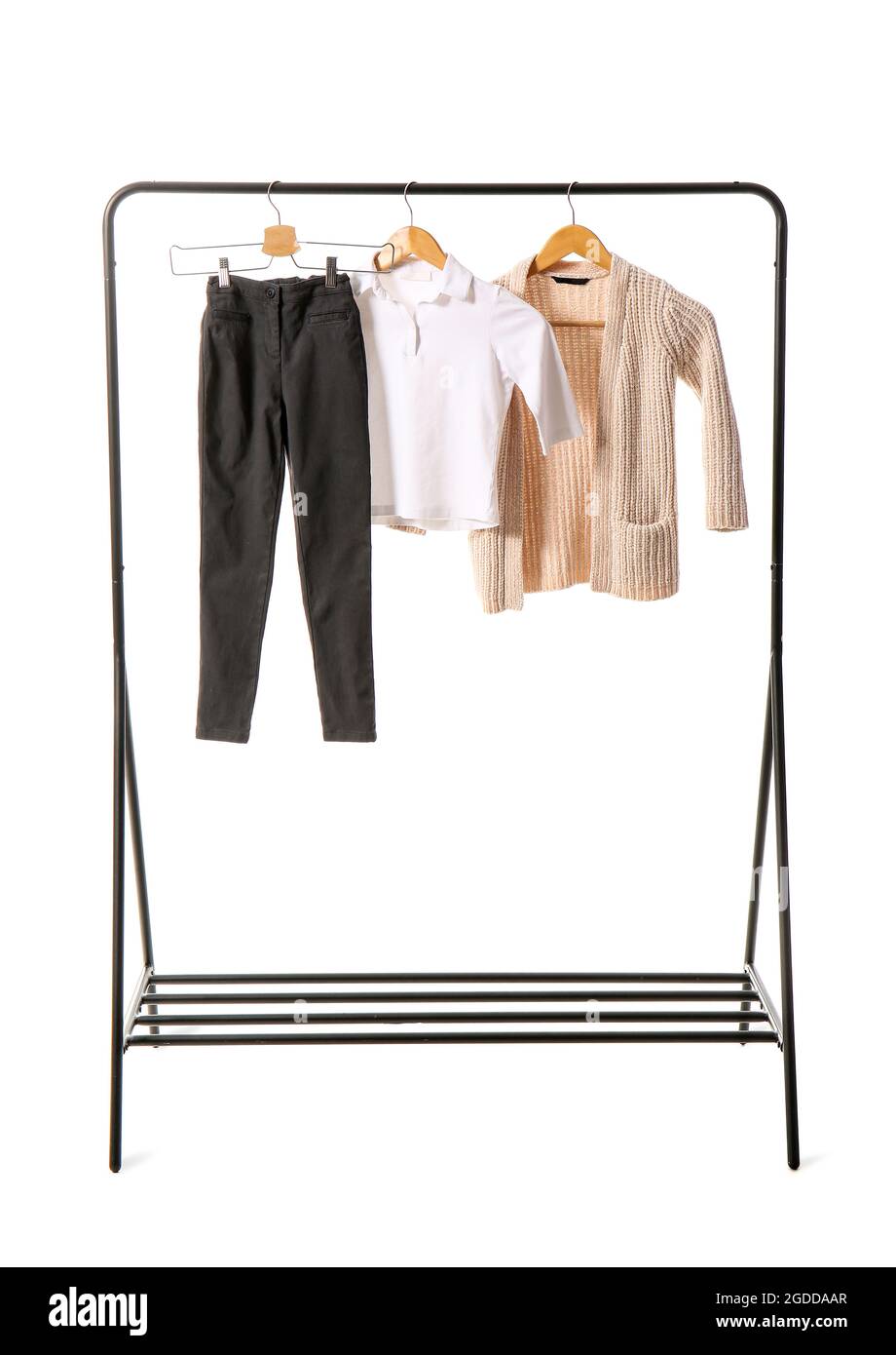 Rack with stylish school uniform on white background Stock Photo - Alamy