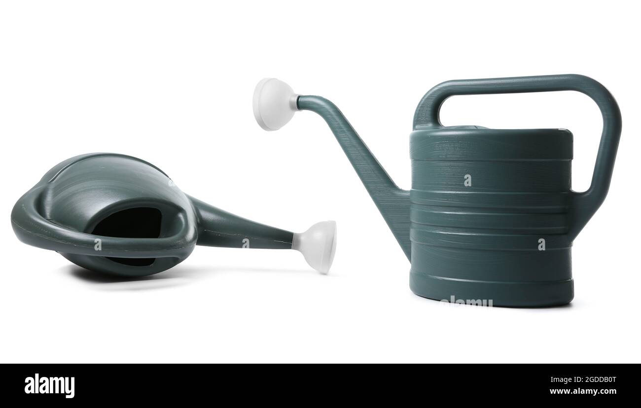 Stylish watering cans on white background Stock Photo - Alamy
