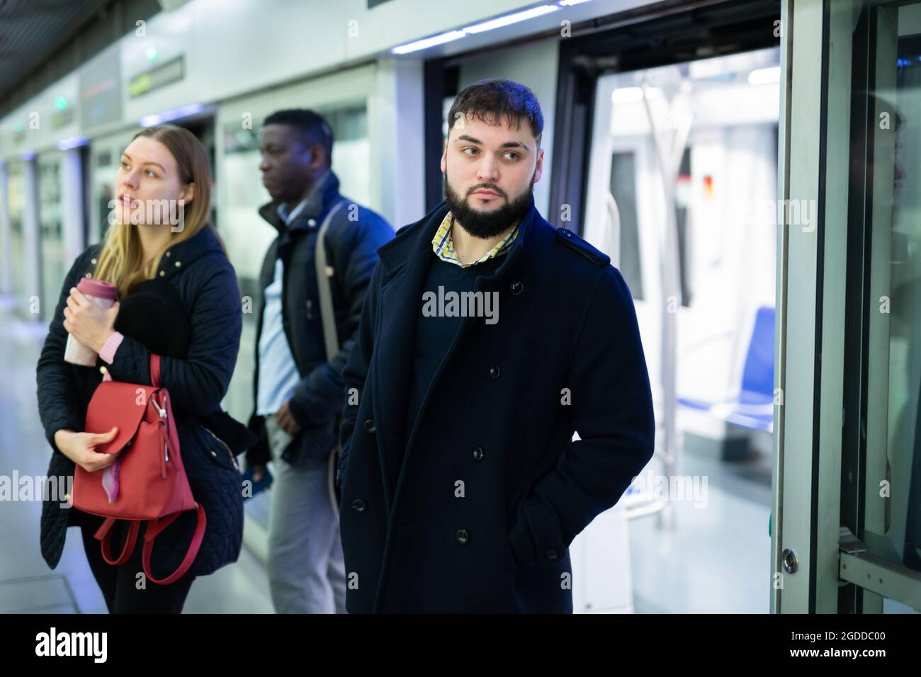 Passengers getting off subway car Stock Photo - Alamy