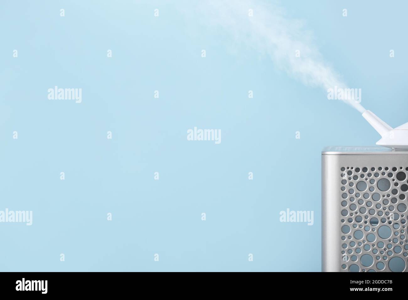 Modern humidifier on color background Stock Photo - Alamy