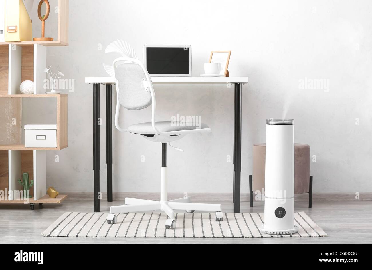 Interior of room with modern humidifier and comfortable workplace Stock ...