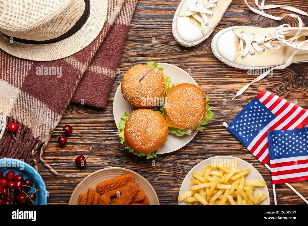 American flags with traditional food, clothes and plaid on wooden ...