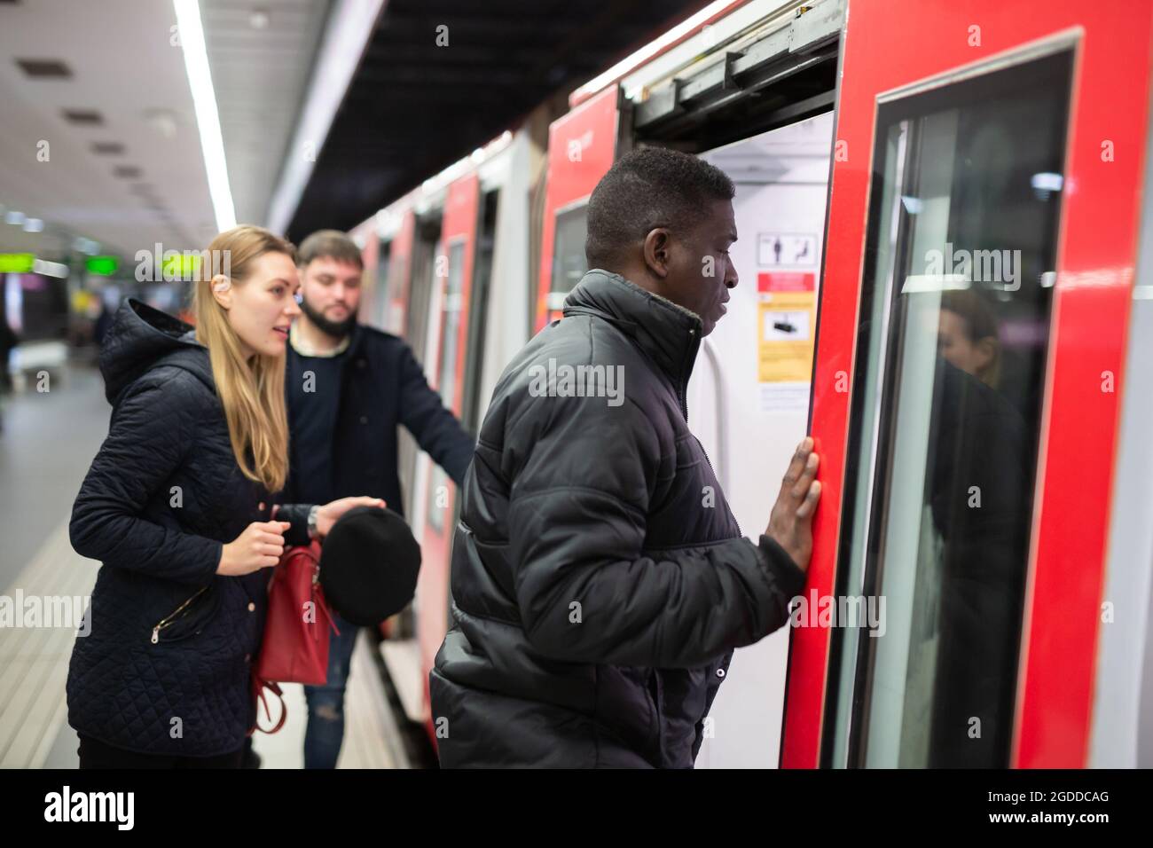 Person getting on subway train hi-res stock photography and images - Alamy