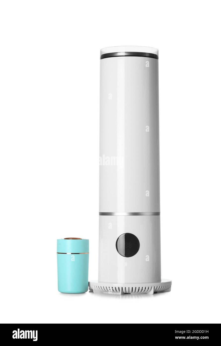 Modern humidifiers on white background Stock Photo - Alamy