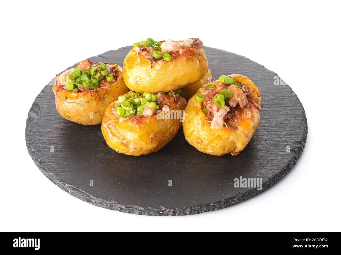 Slate plate with baked potato on white background Stock Photo - Alamy