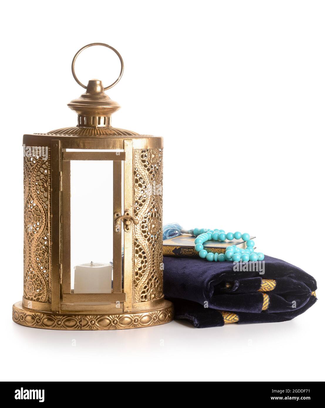 Muslim lantern with prayer rug, tasbih and Quran on white background ...