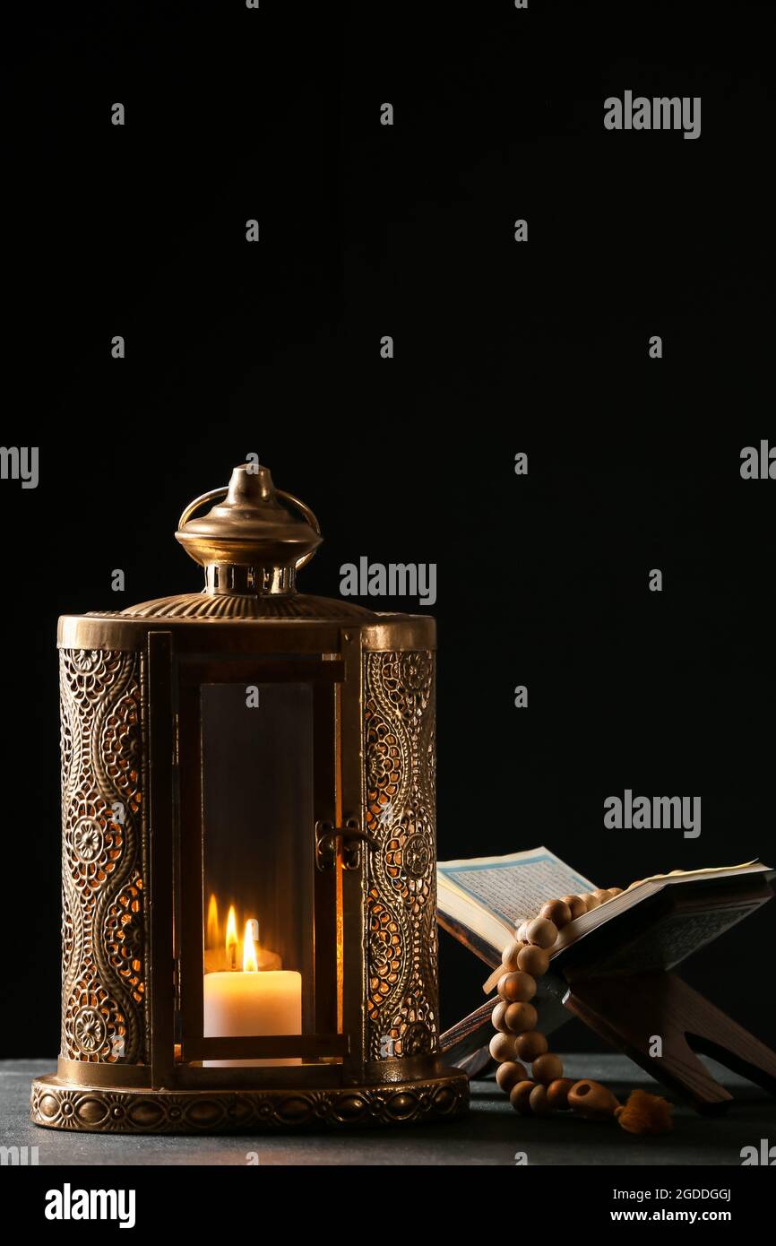 Muslim lantern with Quran and tasbih on dark background Stock Photo - Alamy