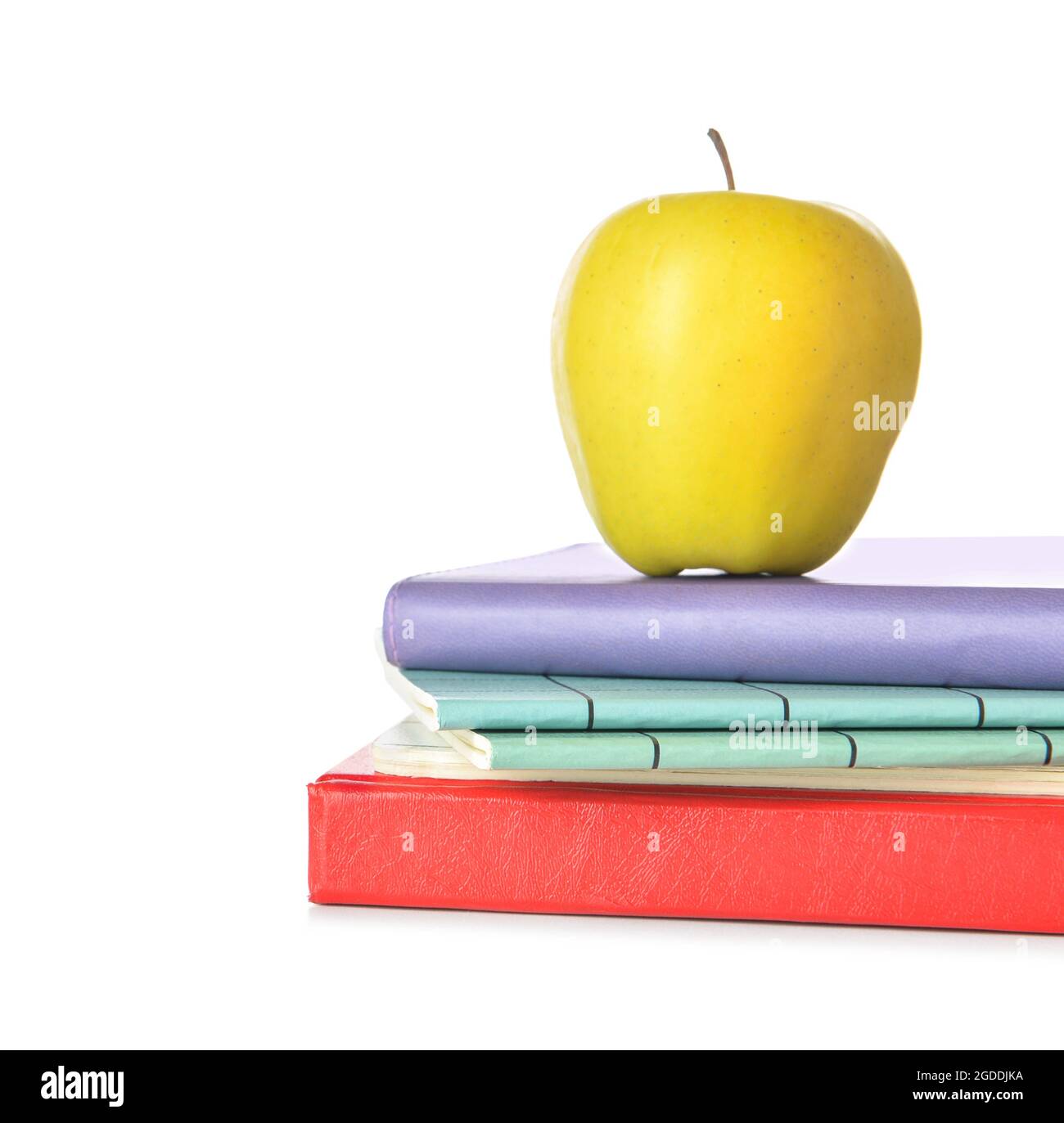 Notebooks and apple on white background Stock Photo - Alamy