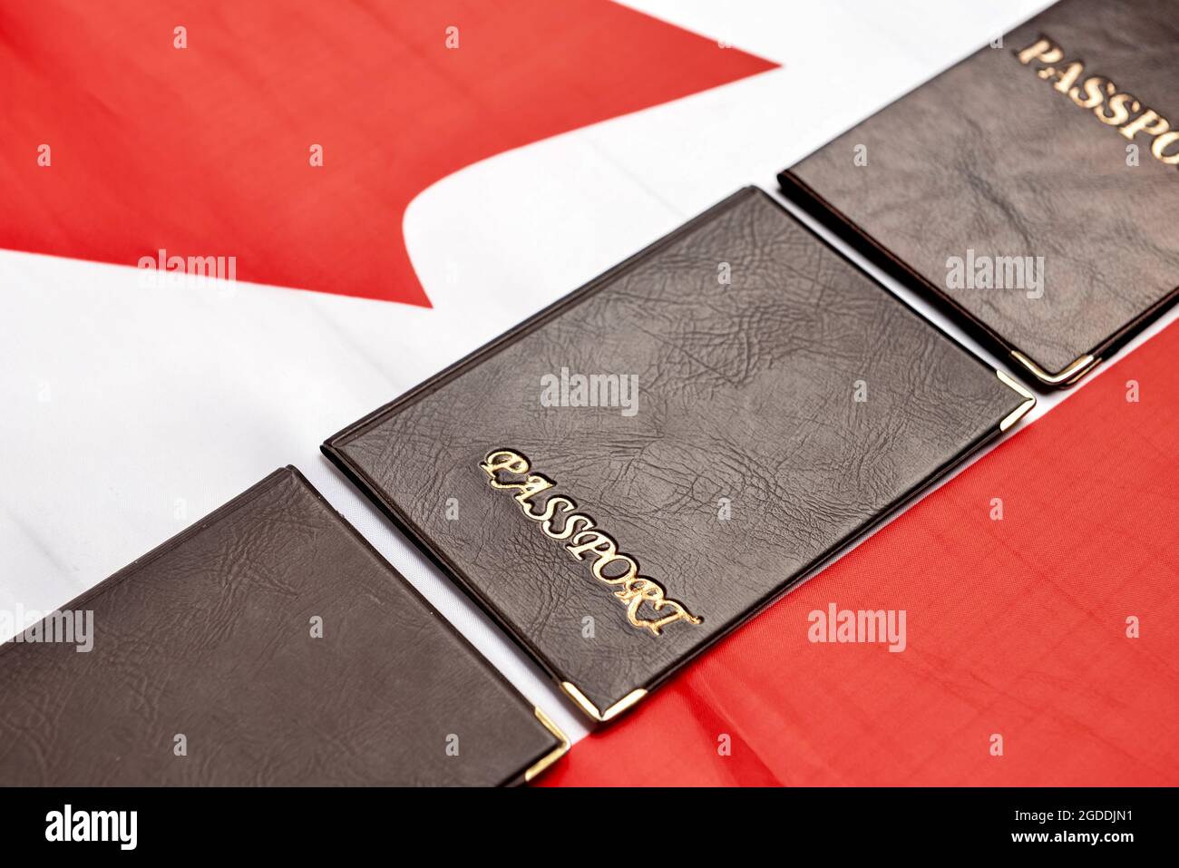Passports on flag of Canada Stock Photo - Alamy