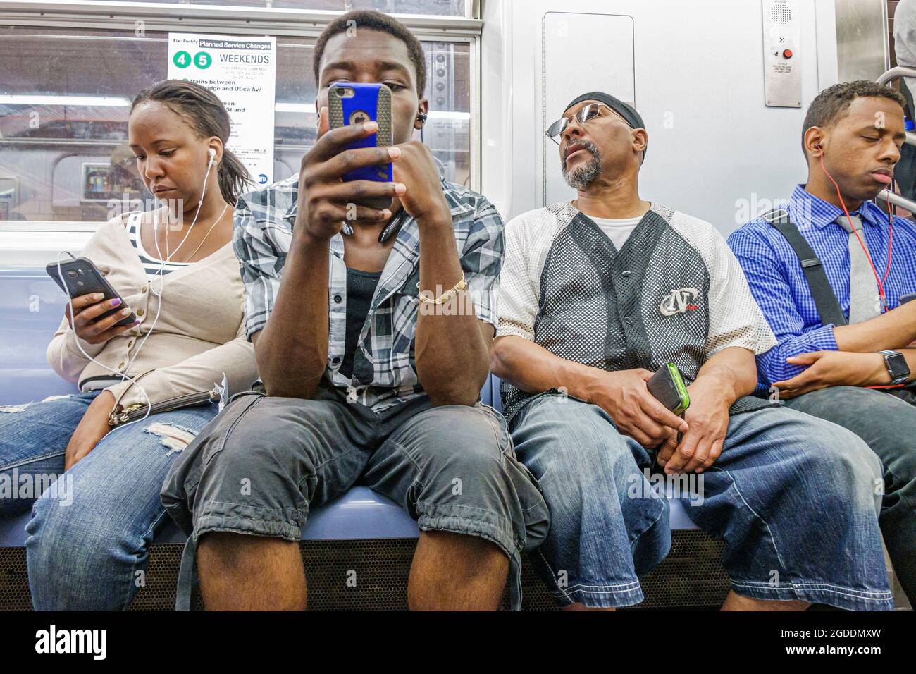 Man texting on train hi-res stock photography and images - Alamy